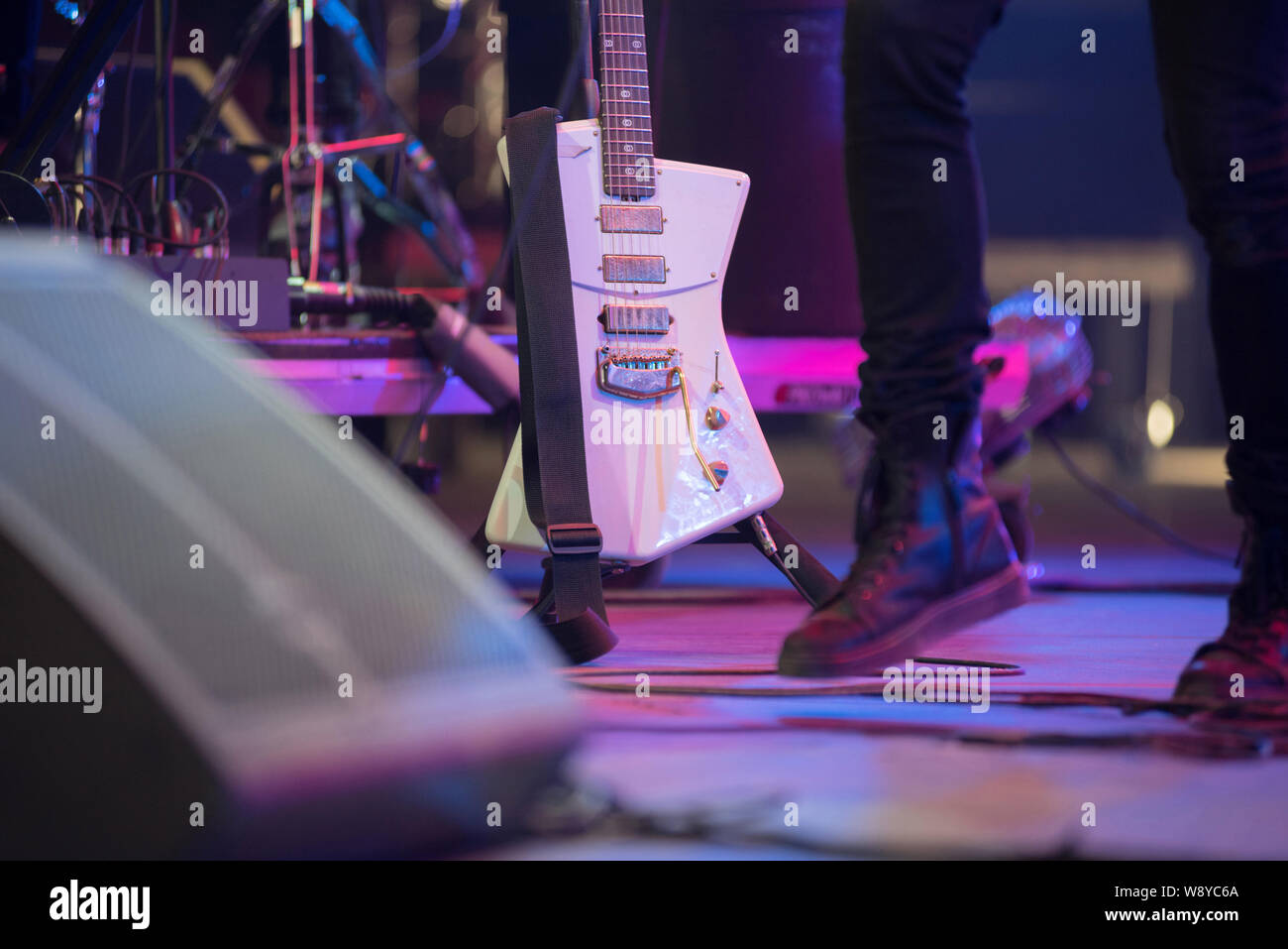 Guitar stand on the stage during concert Stock Photo - Alamy