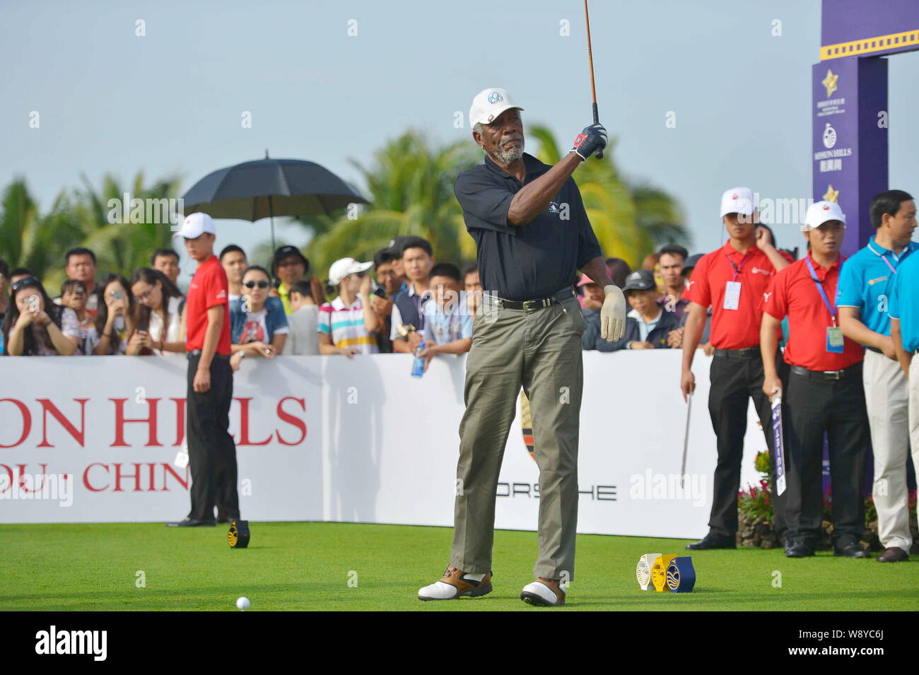 American actor Morgan Freeman prepares to tee off during a session of ...