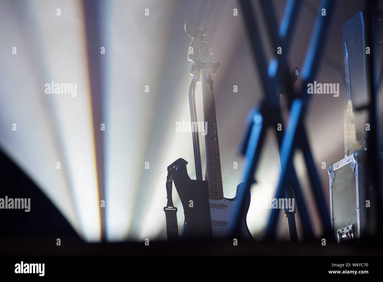 Guitar stand on the stage during concert Stock Photo - Alamy