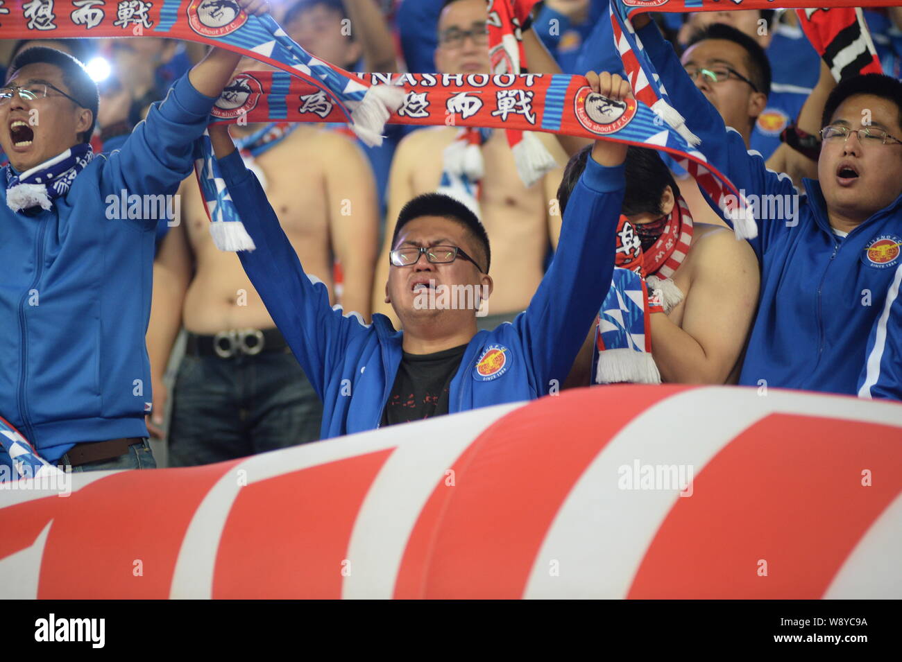 Local Chinese fans shout slogans to show support for Harbin Yiteng ...