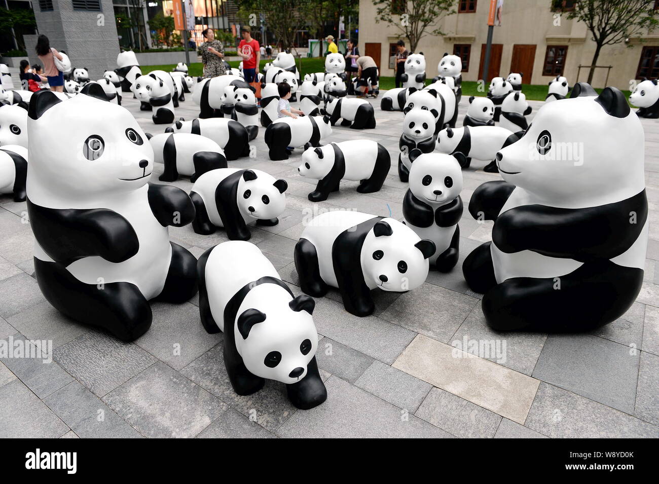 Visitors view bamboo-made pandas during the exhibition, 1st Panda, at ...