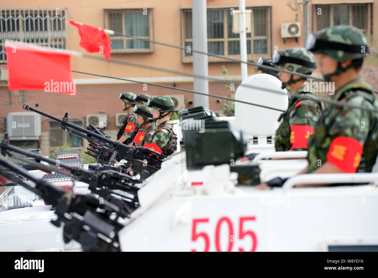 Armed Chinese paramilitary policemen assemble during a city patrol in ...