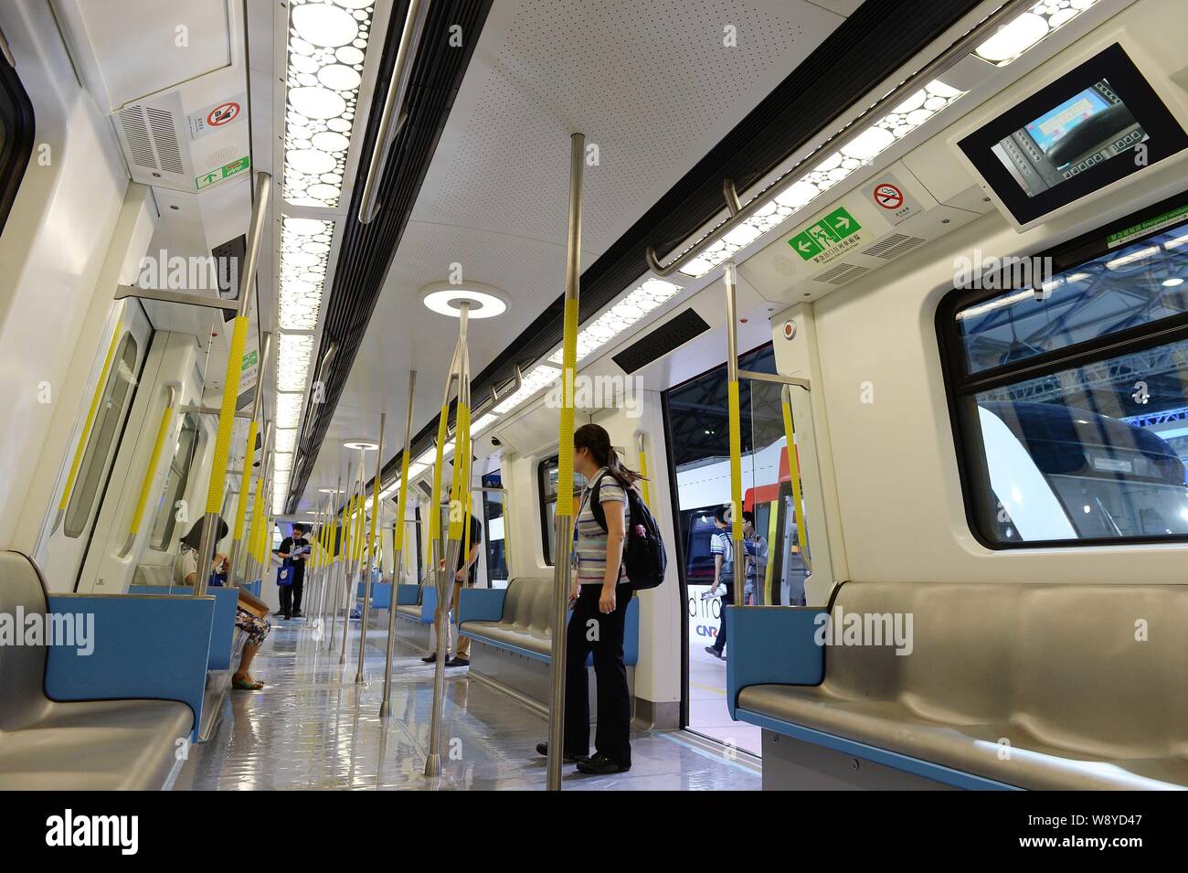 People visit Chinas first driverless subway train during the Rail ...