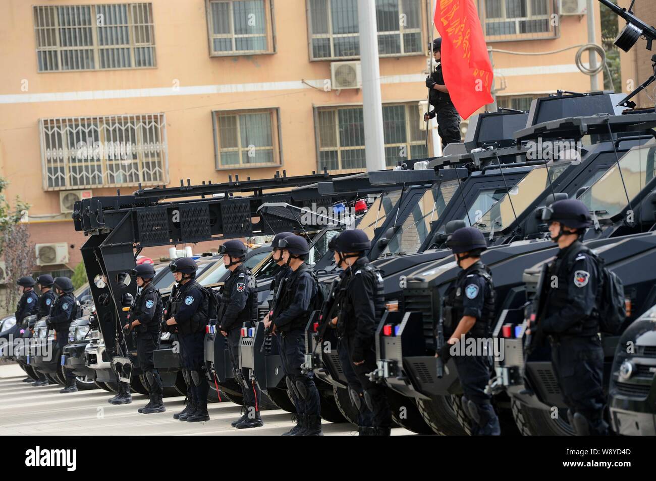 SWAT police officers armed with guns assemble during a city patrol in ...