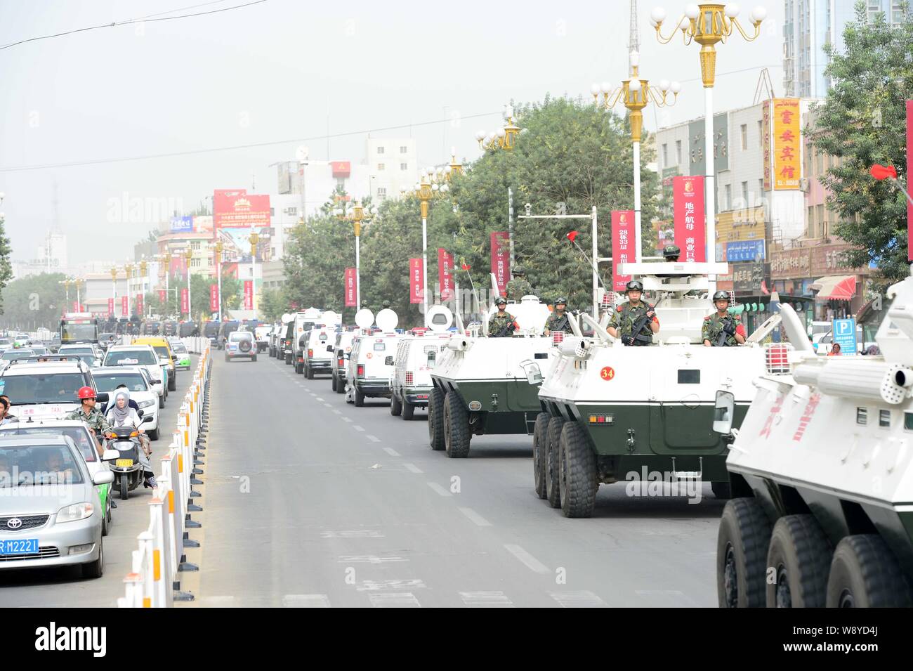--FILE--Armored vehicles of the Chinese paramilitary force patrol a ...