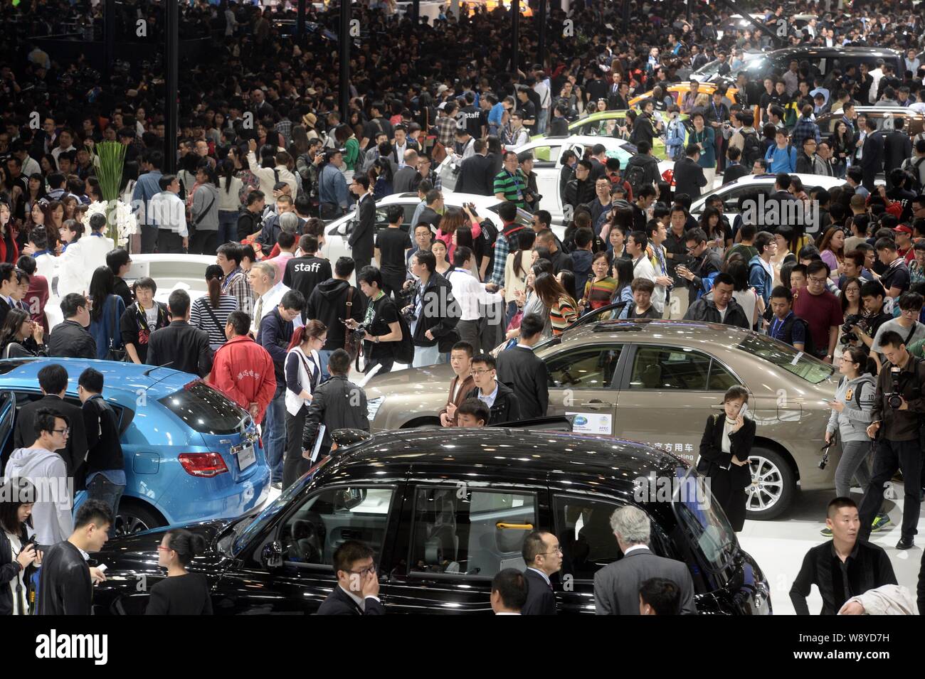 Visitors crowd around Geely cars during the 13th Beijing International ...