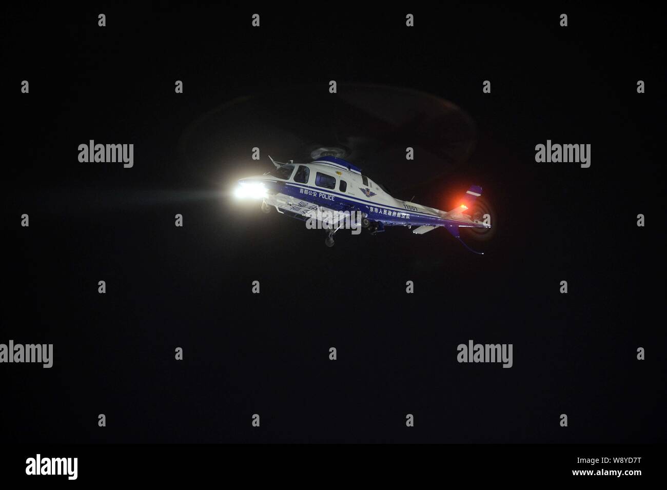 A police aircraft flies during a city patrol in Beijing, China, 8 May ...