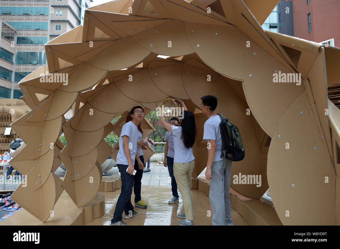 Chinese students build their paper house at the campus of Chongqing ...