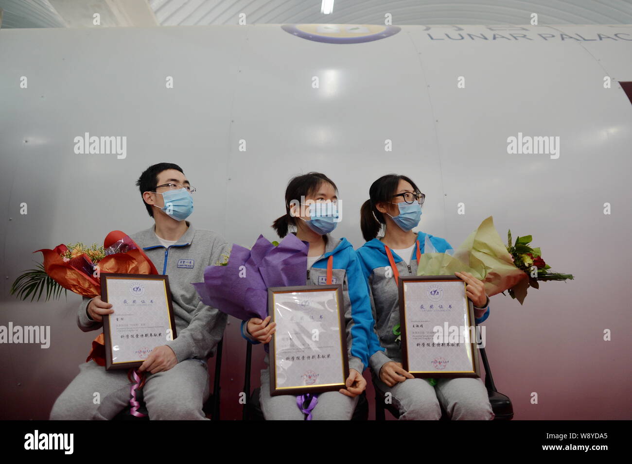 Captain Xie Beizhen, center, and her crew members Dong Chen, left, and Wang Minjuan hold ...