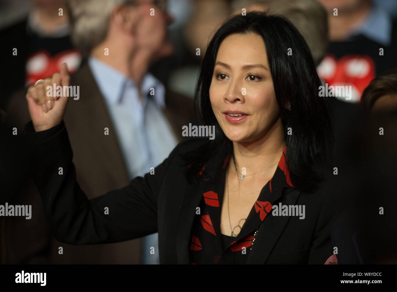 Hong Kong actress Carina Lau dances at the concert of English rock band ...