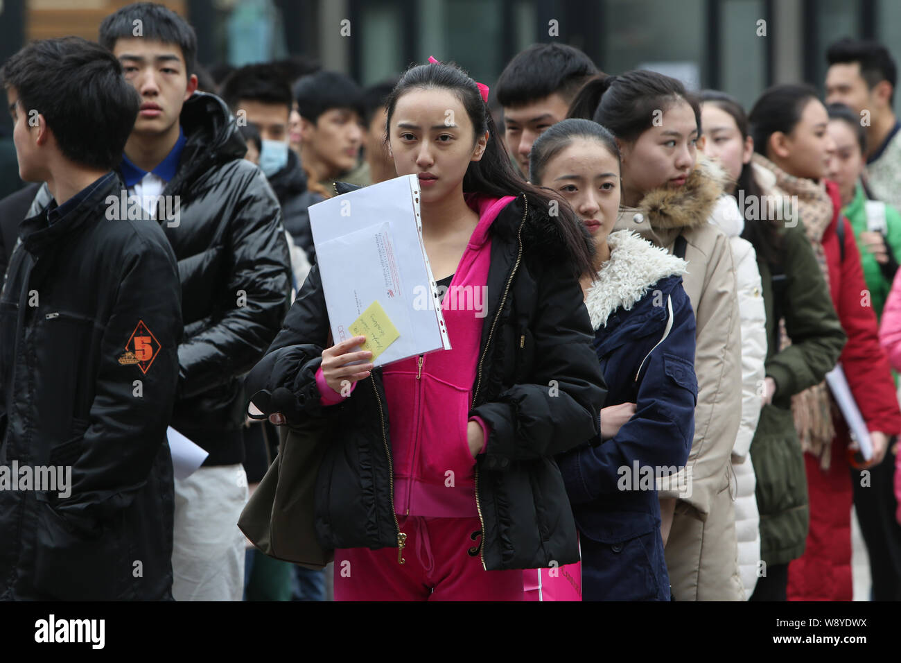 Young Chinese examinees queue up for an entrance exam of the Shanghai ...