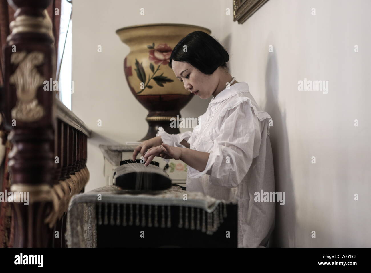 35-year-old Yang Xiaoting plays guqin, a plucked seven-string Chinese ...