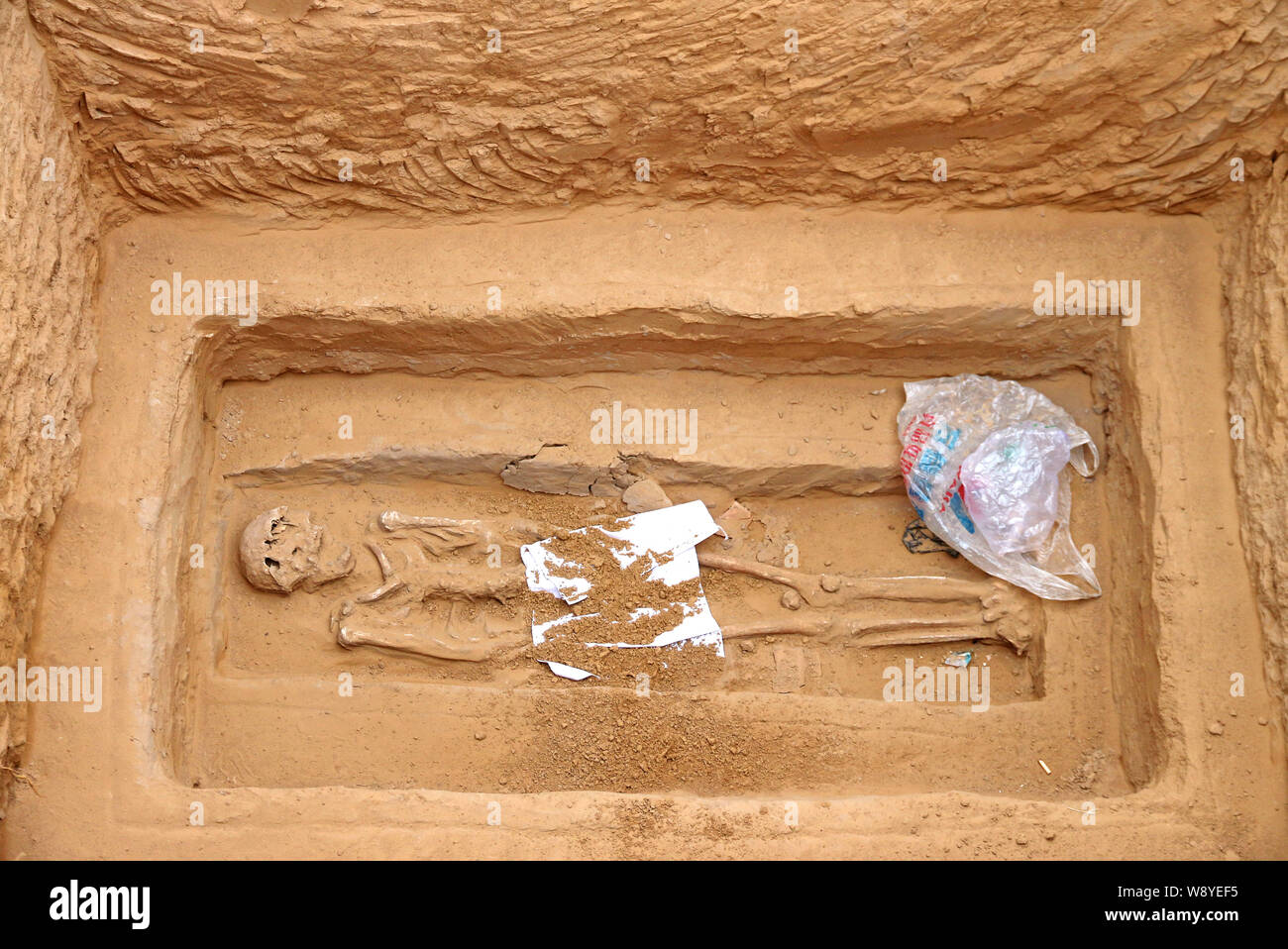 View of a skeleton in an ancient tomb of the late Warring States Period ...