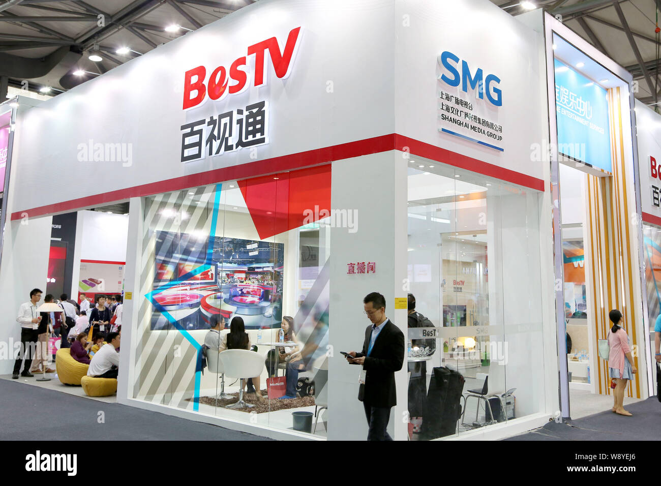 People visit the stand of BesTV and SMG (Shanghai Media Group) during ...