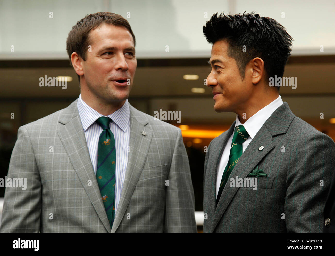English football star Michael Owen, left, talks with Hong Kong singer ...