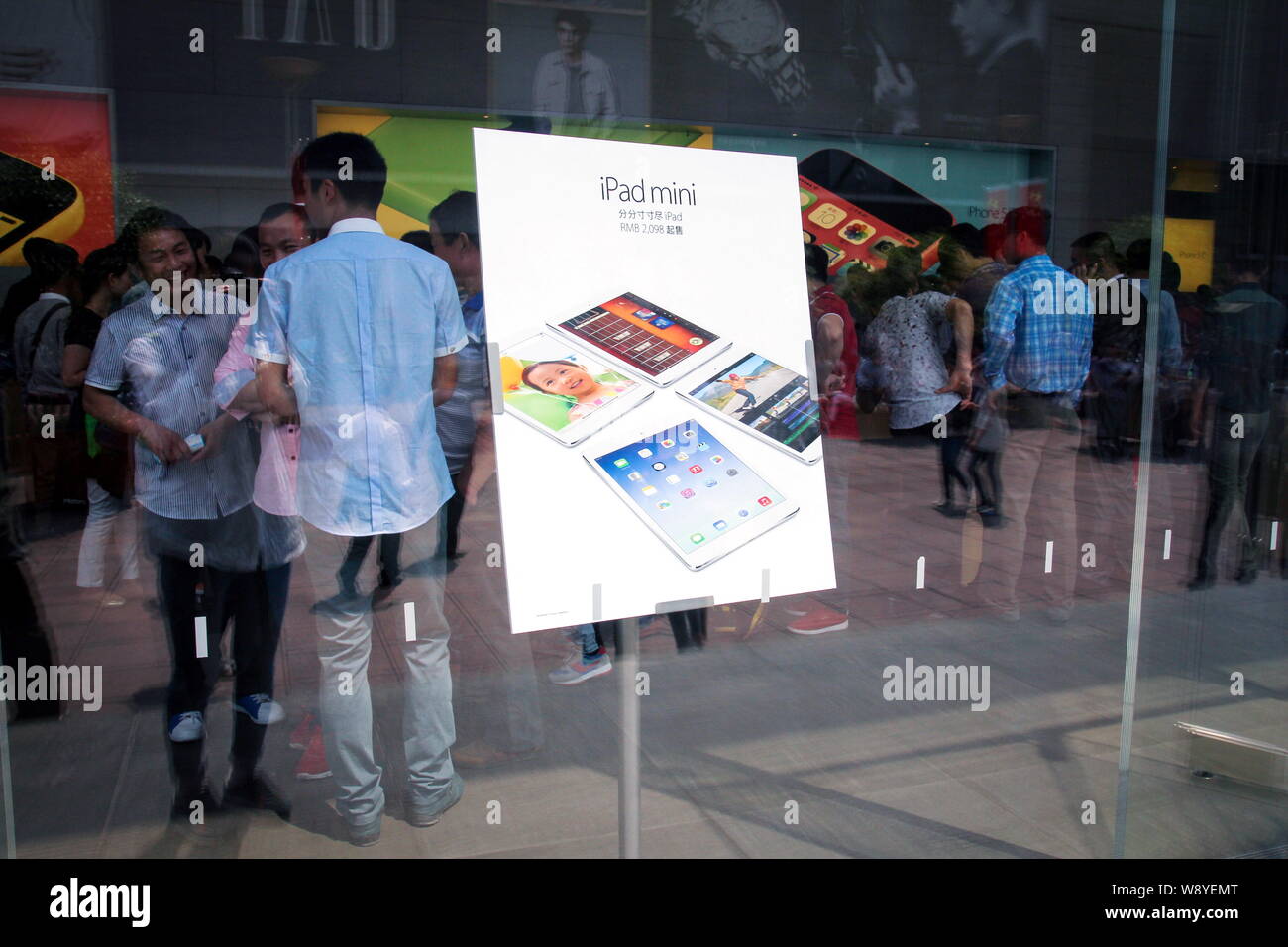 --FILE--A signboard for the iPad mini tablet PC is on display in the ...