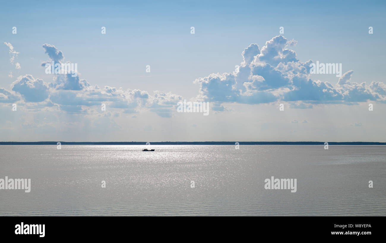 Cargo ship horizon blue sky clouds hi-res stock photography and images ...
