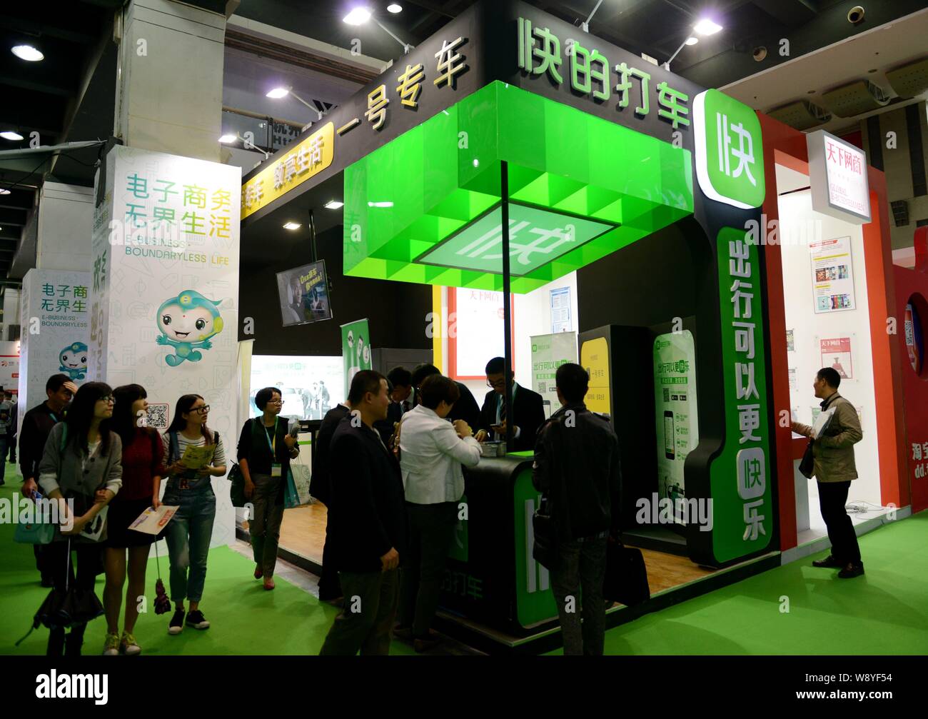 --FILE--People visit the stand of taxi booking app Kuaidi Dache of ...