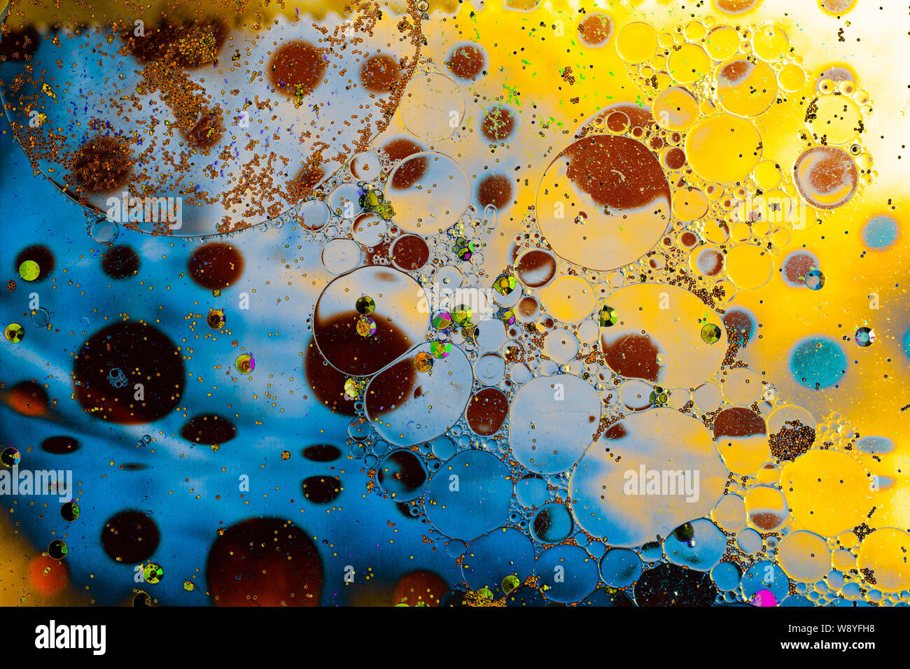 Oil bubbles inside water base form patterns Stock Photo - Alamy
