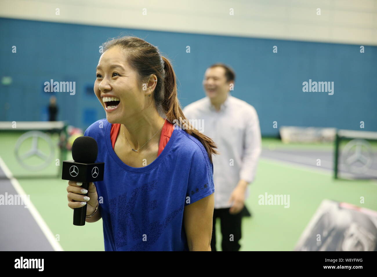 Retired Chinese tennis star Li Na reacts at a promotional event of ...
