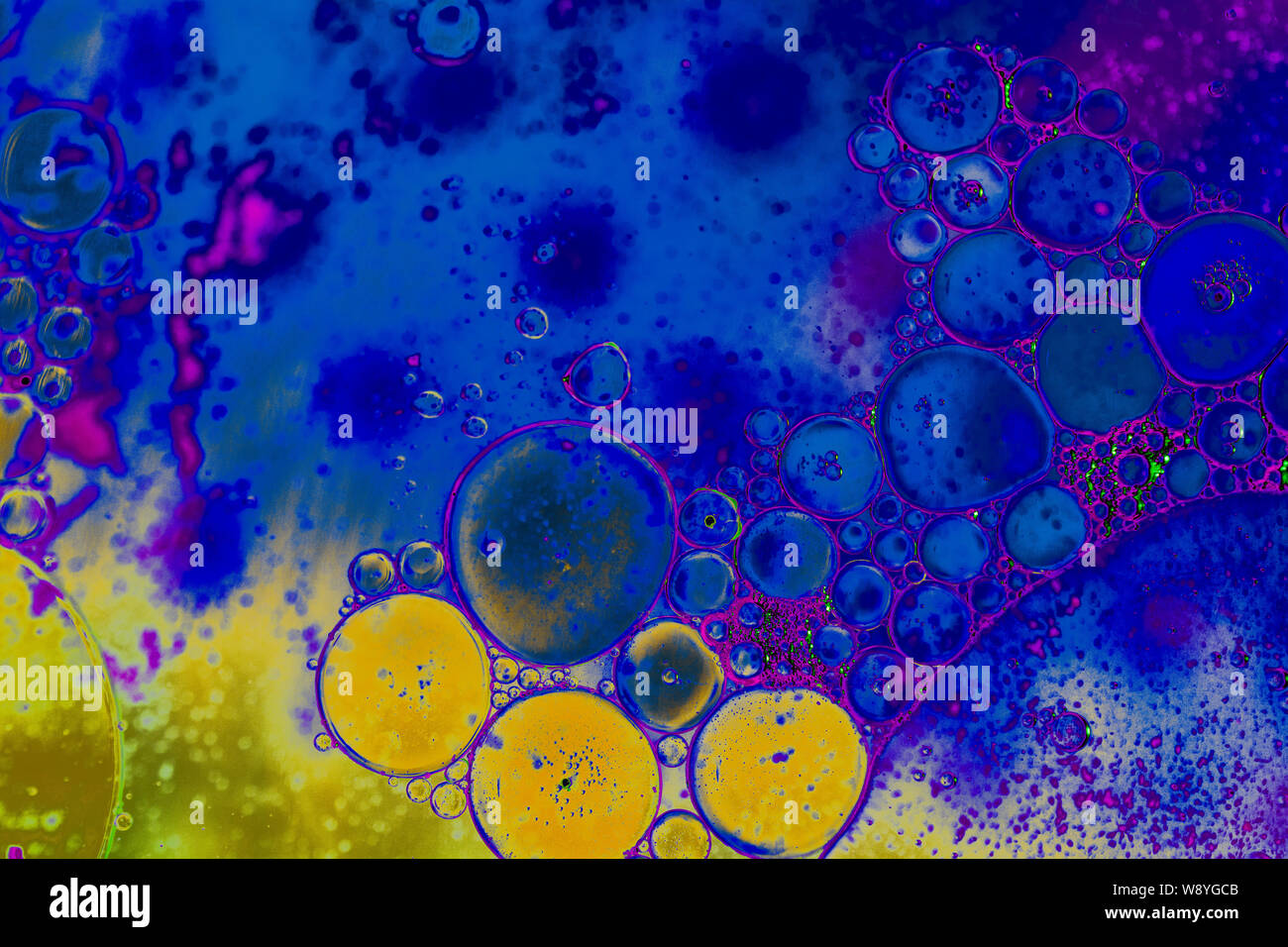 Oil bubbles inside water base form patterns Stock Photo - Alamy