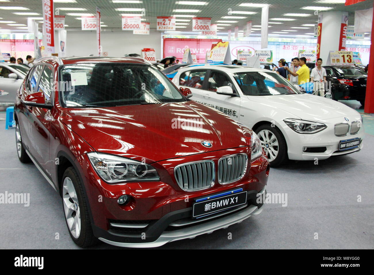 --FILE--Visitors look at BMW cars on display during an auto show in ...