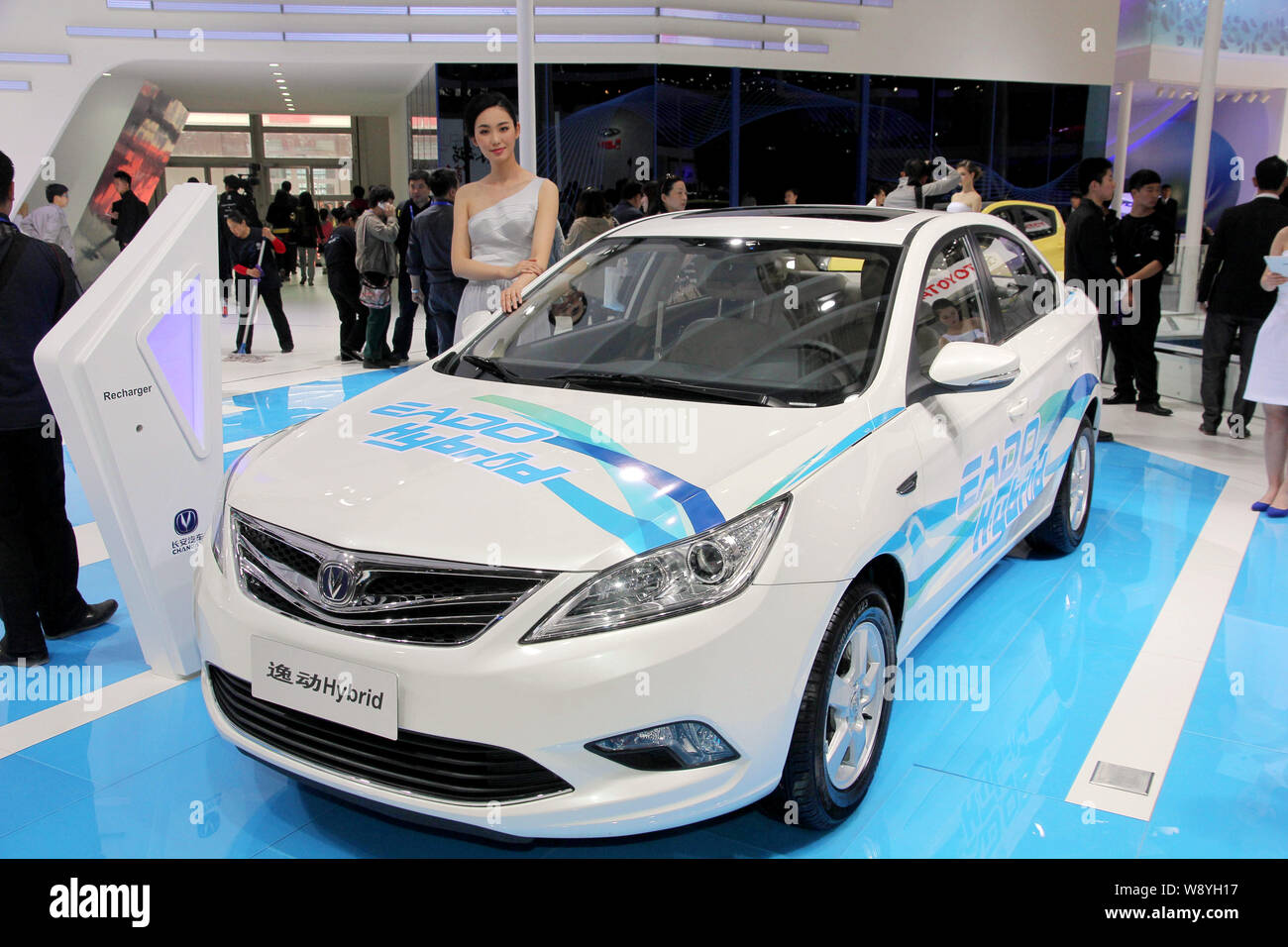 --FILE--A model poses with a ChangAn Eado hybrid car during the 13th ...