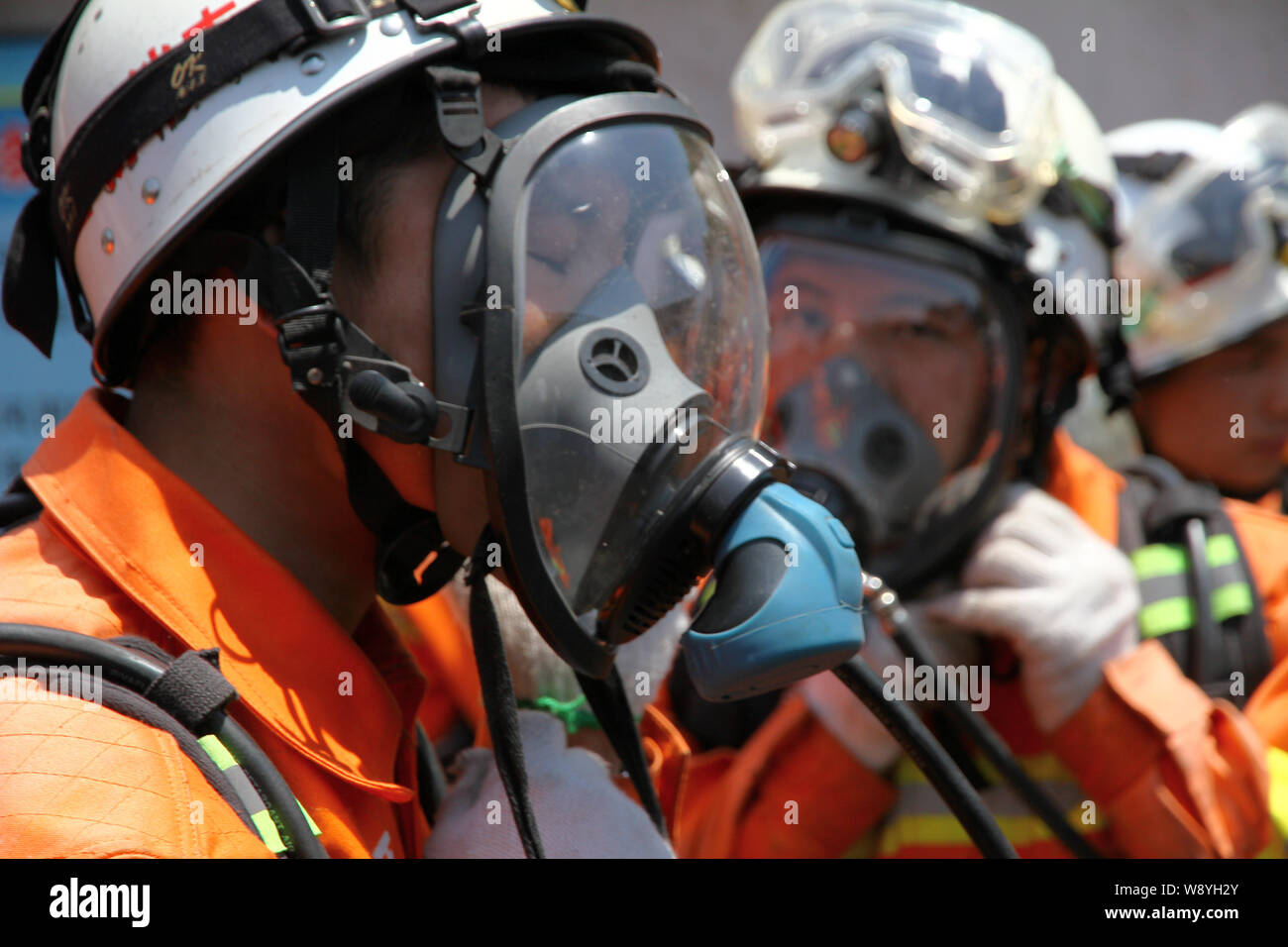 Rescuers are wearing gas masks after a gas explosion at a pit of ...