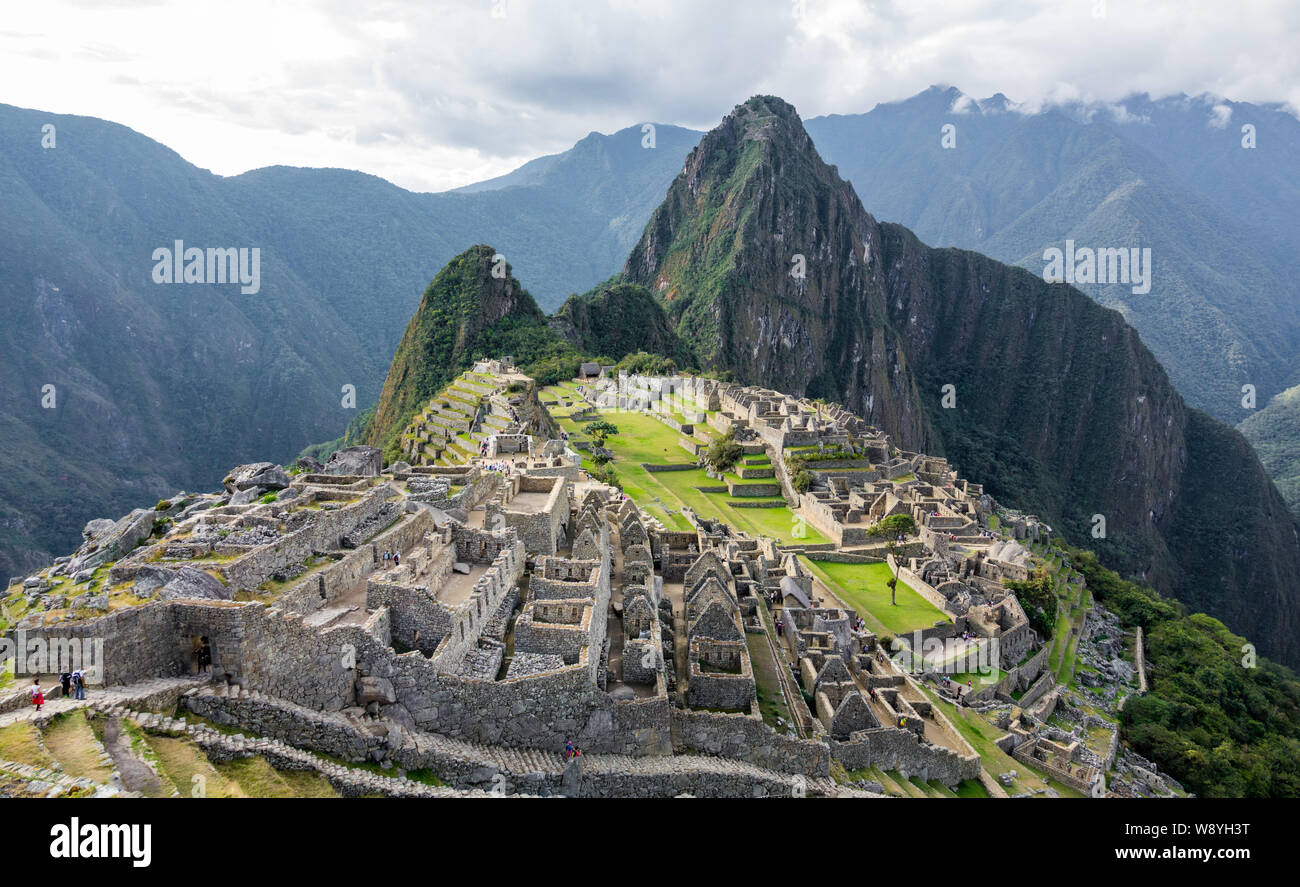 Lost city of Machu Picchu and its ruins in Peru. Some clouds and ...