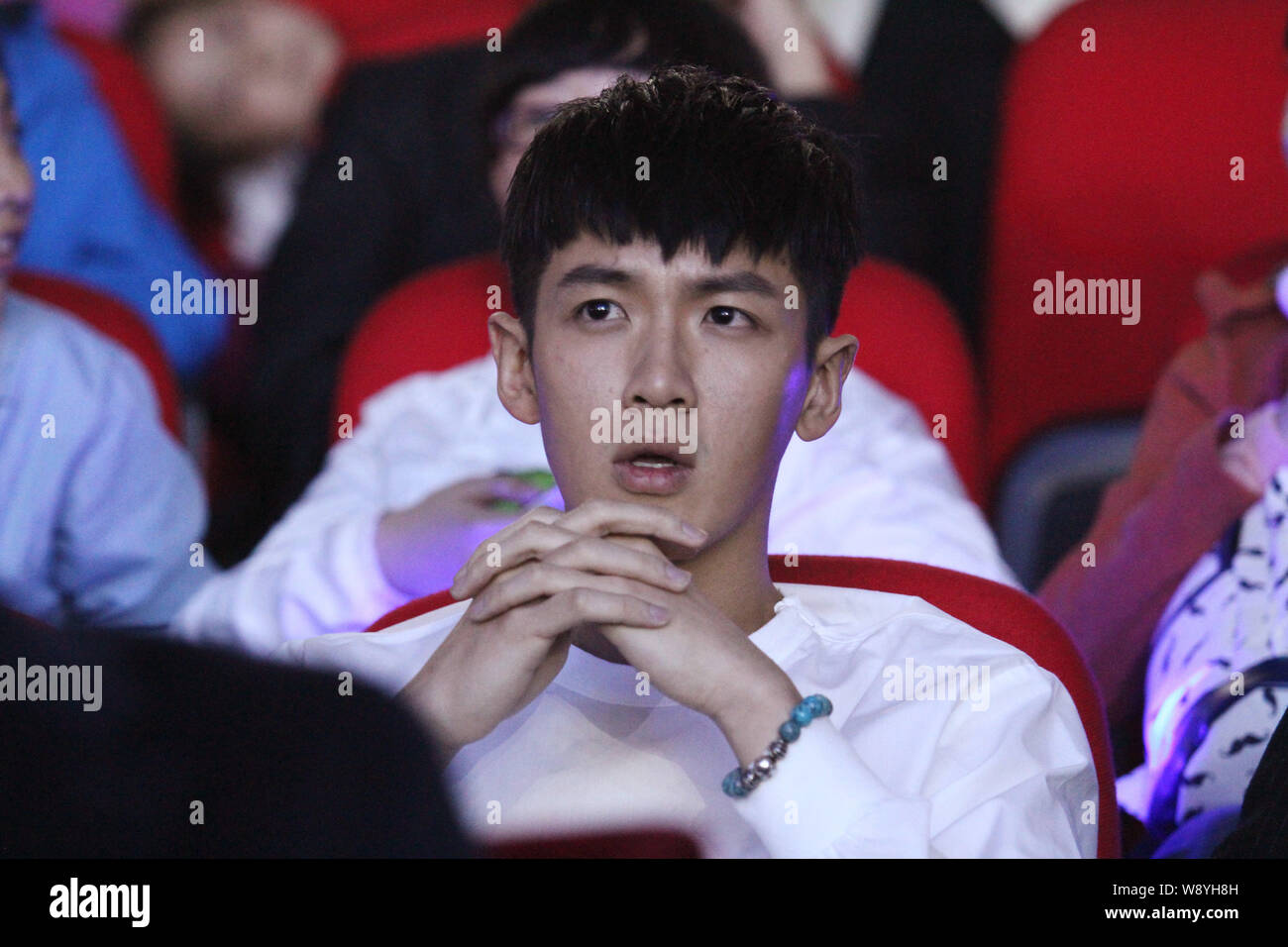 --FILE--Taiwanese actor Kai Ko watches a performance during Jackie Chan ...
