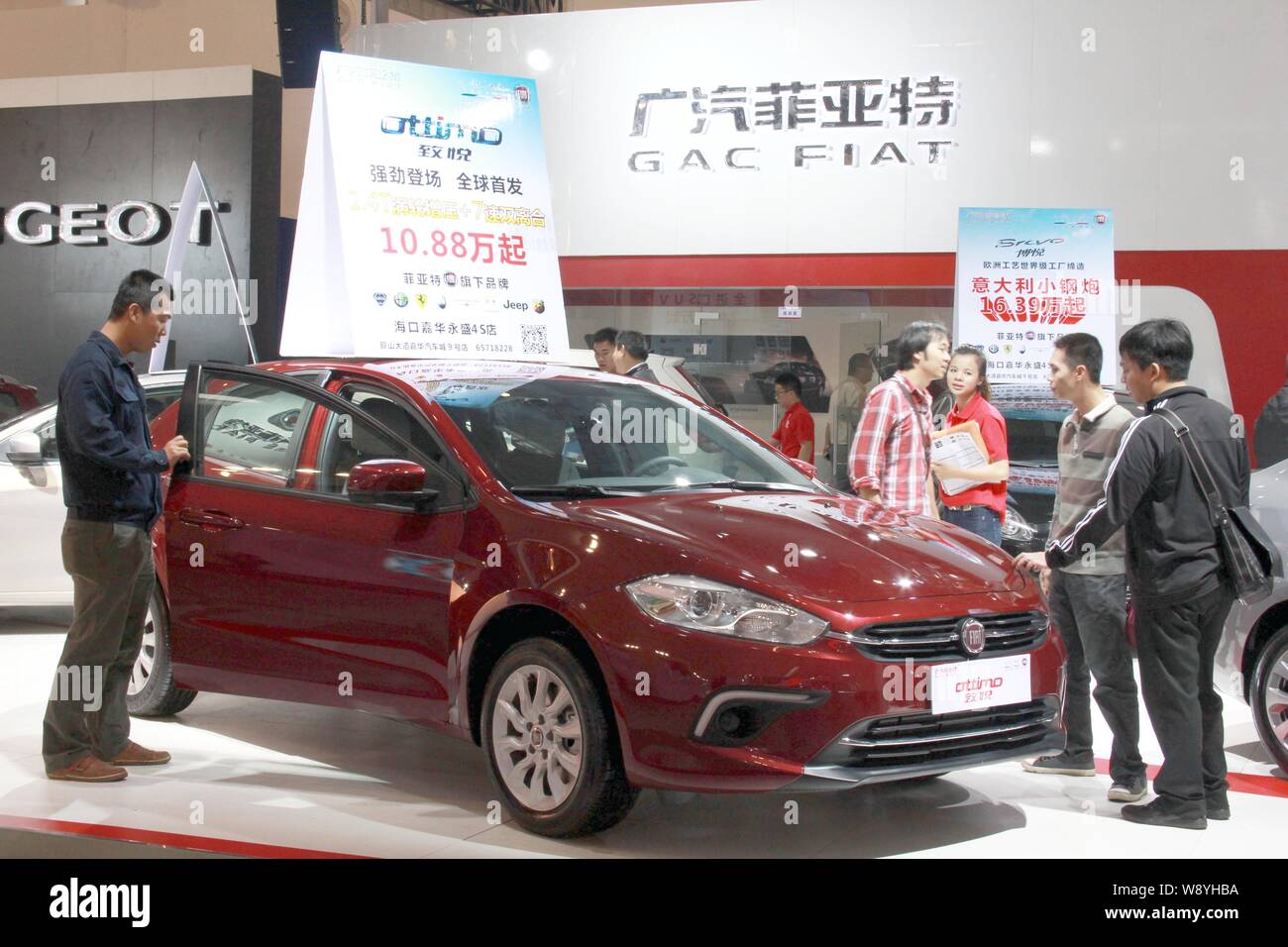 --FILE--Visitors look at a Fiat Ottimo on display at an auto show in ...