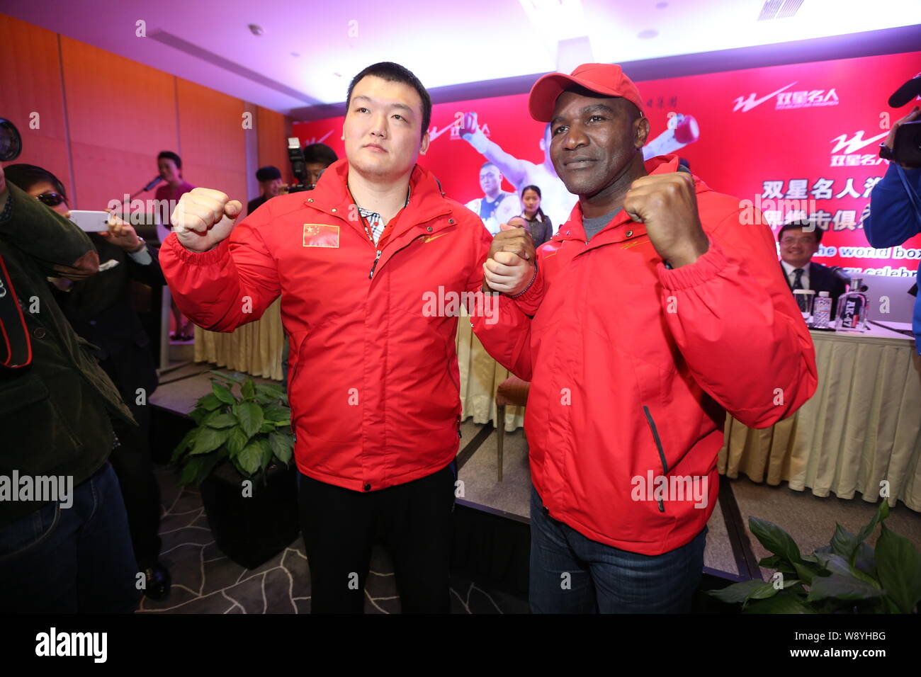 Chinese professional boxer Zhang Junlong, left, poses with retired U.S ...