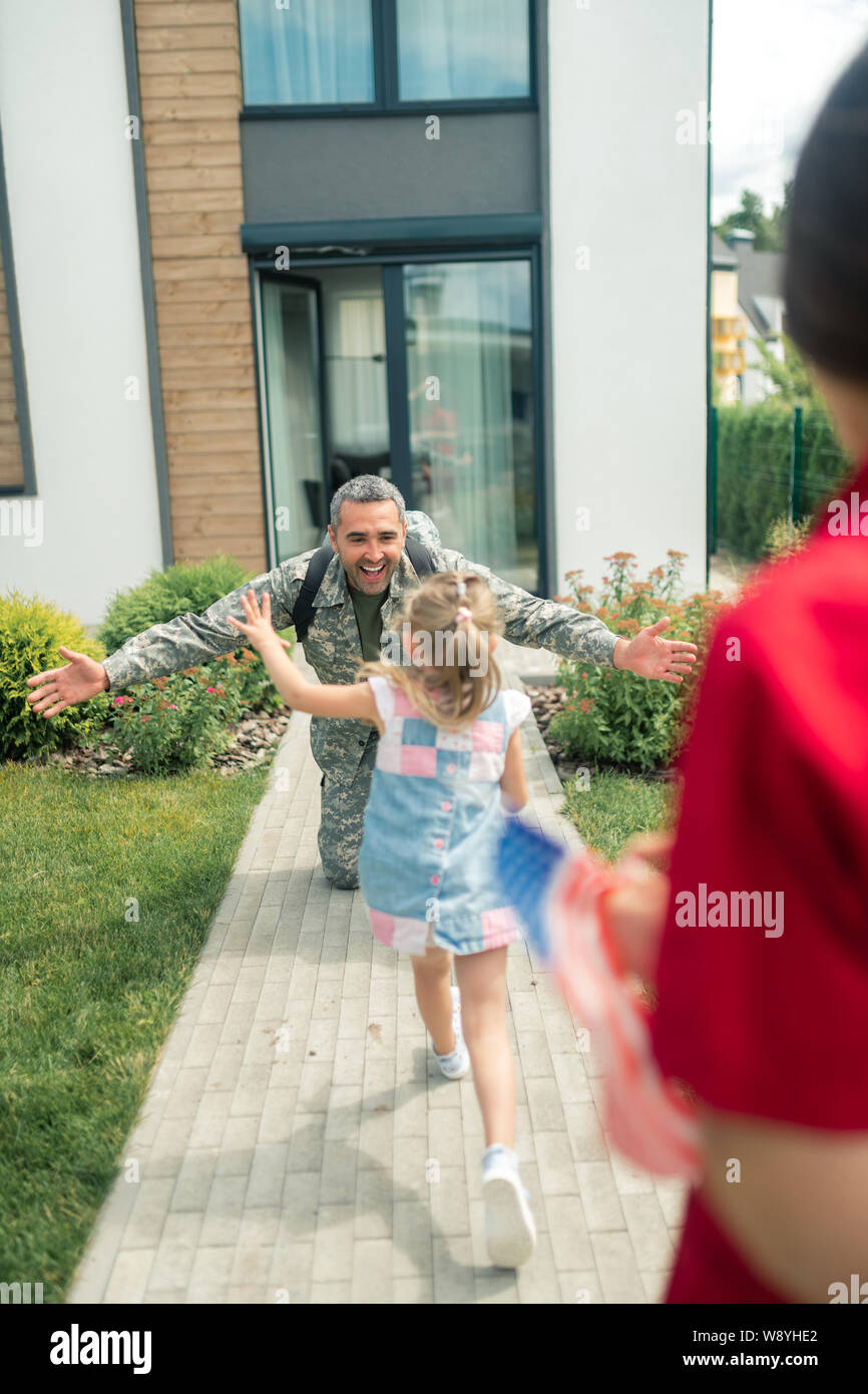 Happy father returning home after half a year of service Stock Photo ...