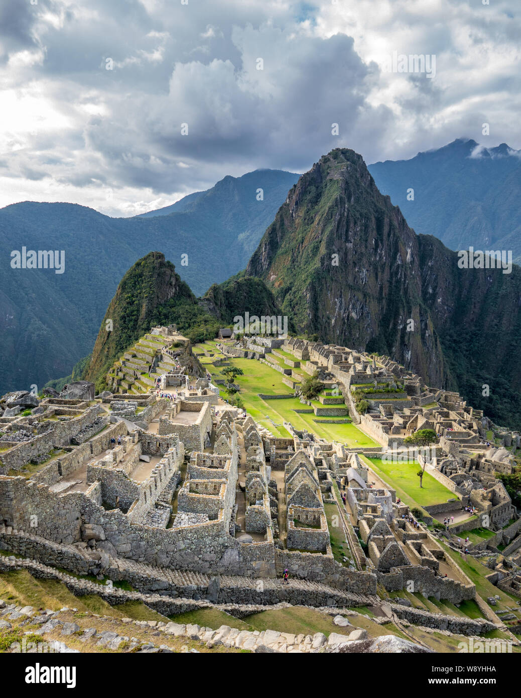 Lost city of Machu Picchu and its ruins in Peru. Some clouds and ...