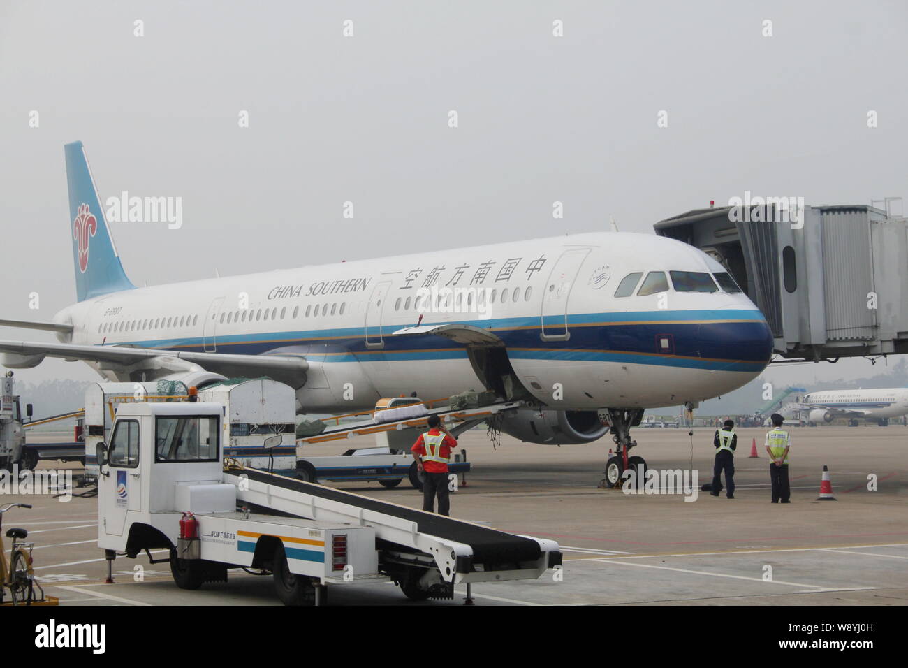 --FILE--Chinese ground crew members are pictured next to a jet plane of ...