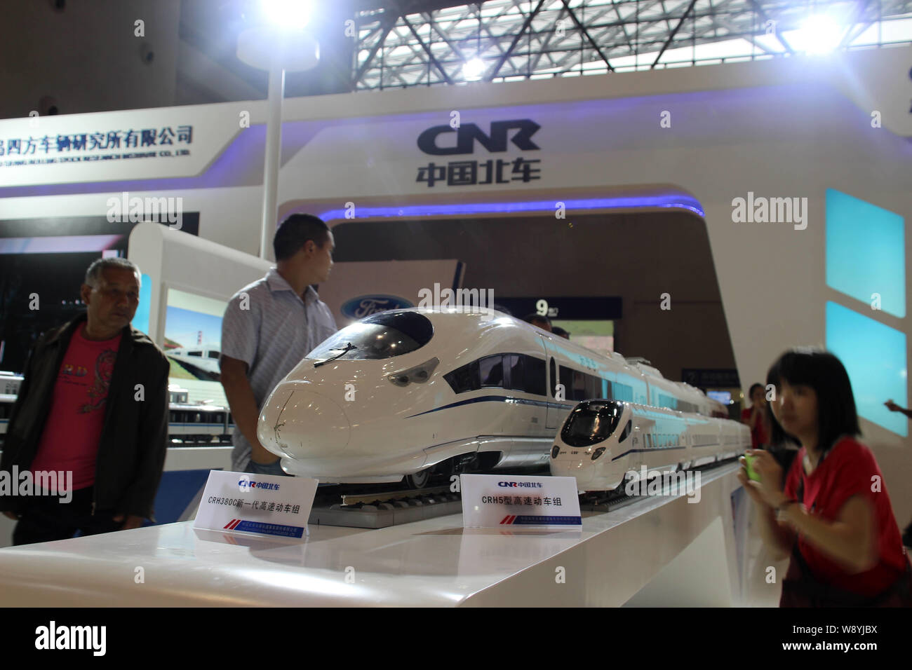 --FILE--Visitors look at models of CRH trains at the stand of CNR ...