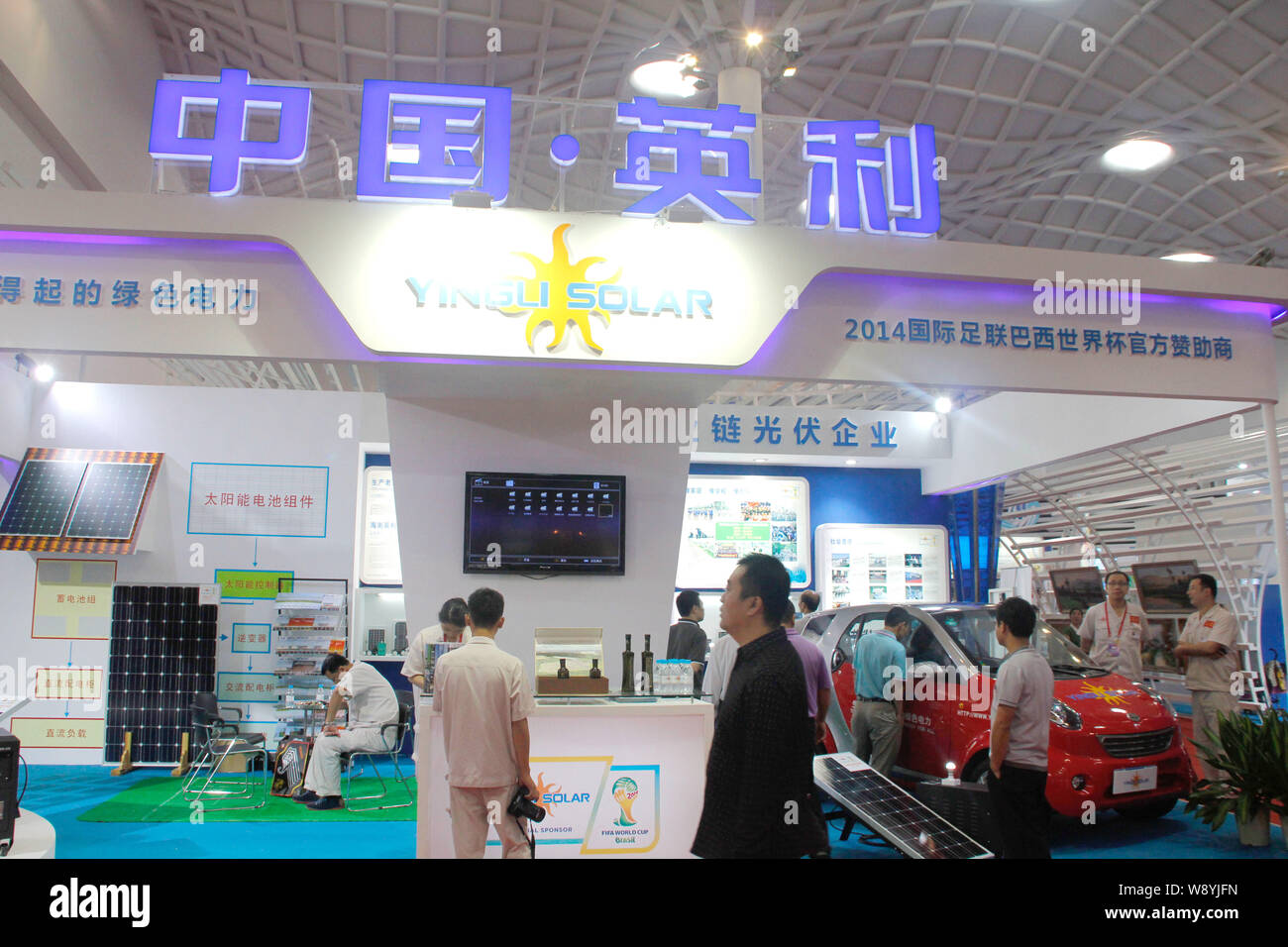 --FILE--People visit the stand of Yingli Solar (Yingli Green Energy ...