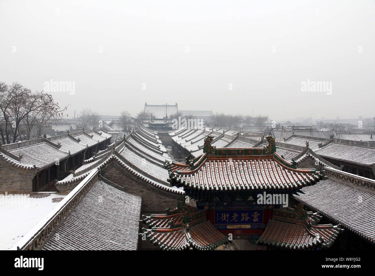 Snowscape of old buildings in Ancient City of Ping Yao in Pingyao ...