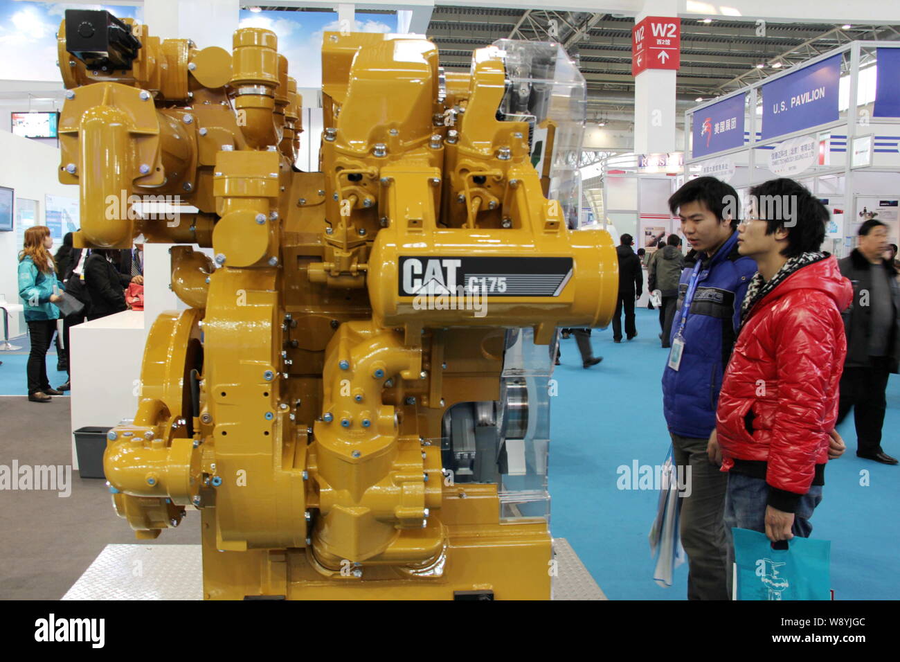 --FILE--Chinese visitors look at a model of Caterpillar oil extraction ...