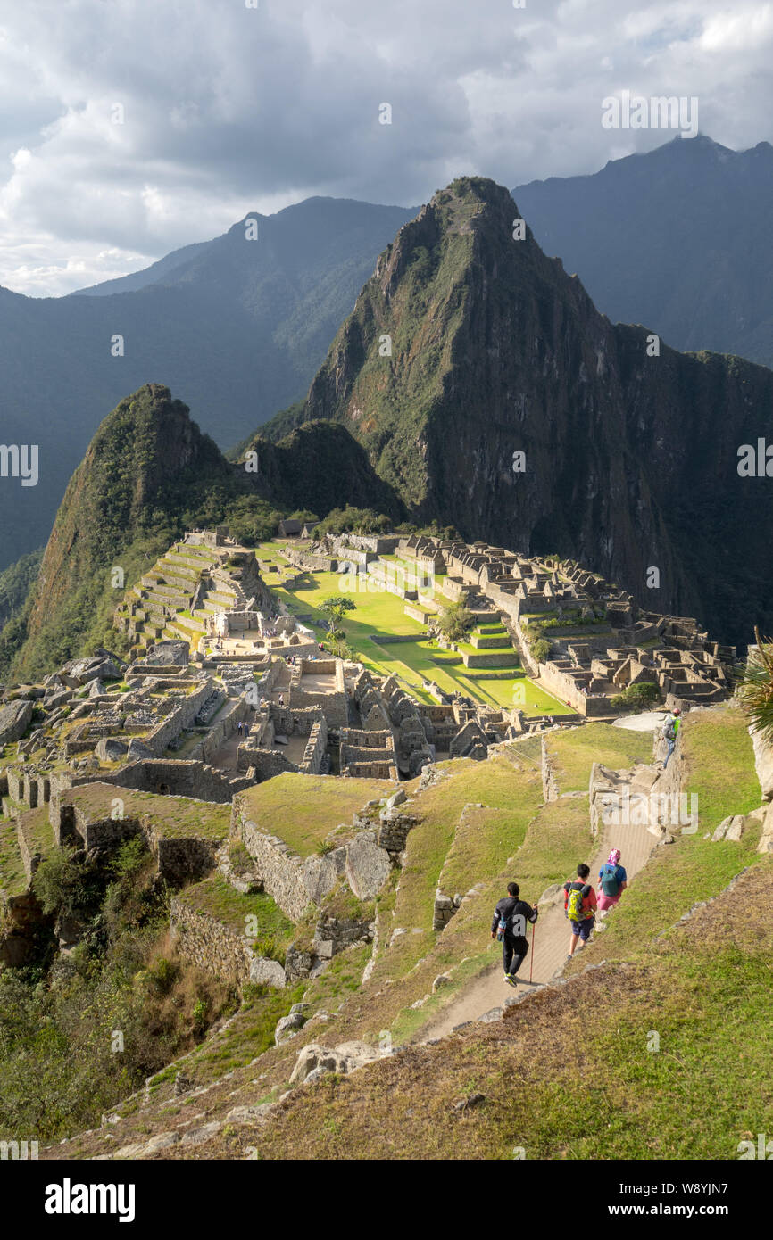 Lost city of Machu Picchu and its ruins in Peru. Some clouds and ...