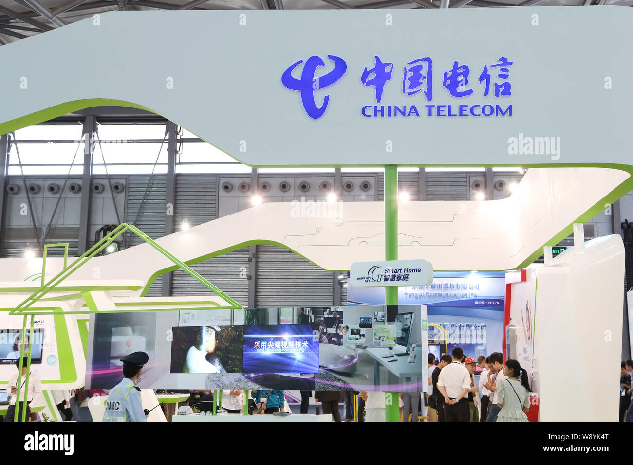 --FILE--People visit the stand of China Telecom during the 3rd Mobile ...