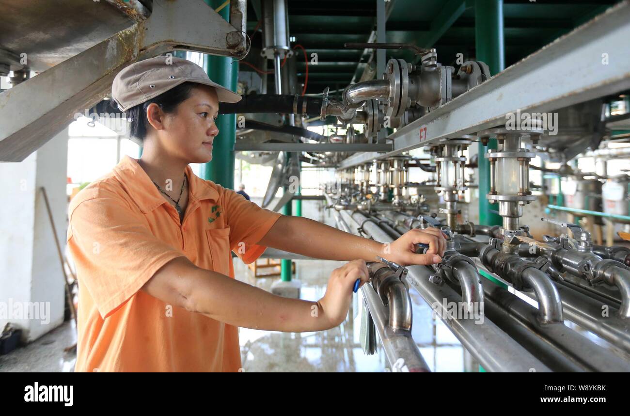 --FILE--A female Chinese worker examines production facilities at a ...