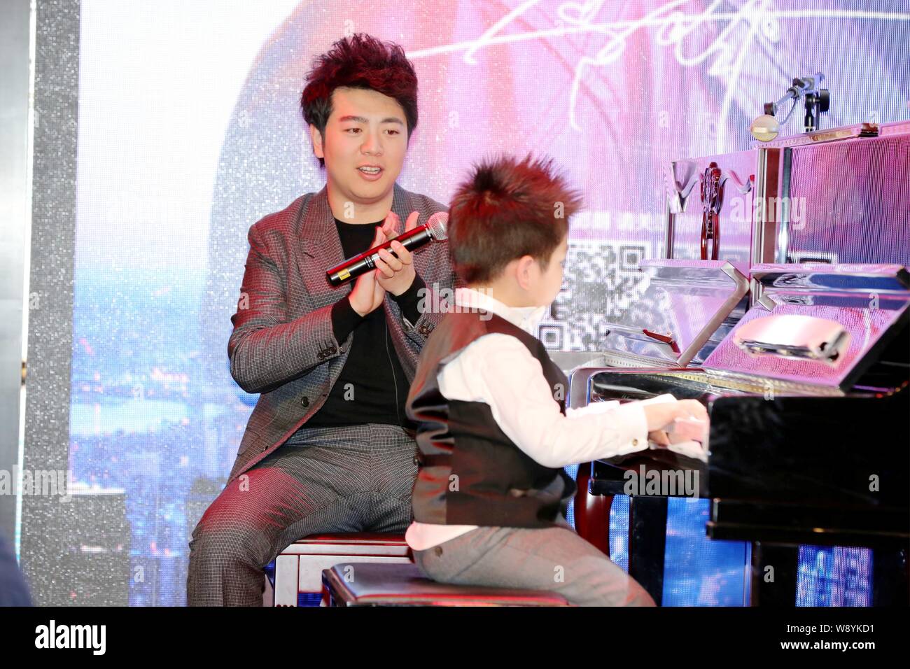 Boy playing piano hi-res stock photography and images - Alamy