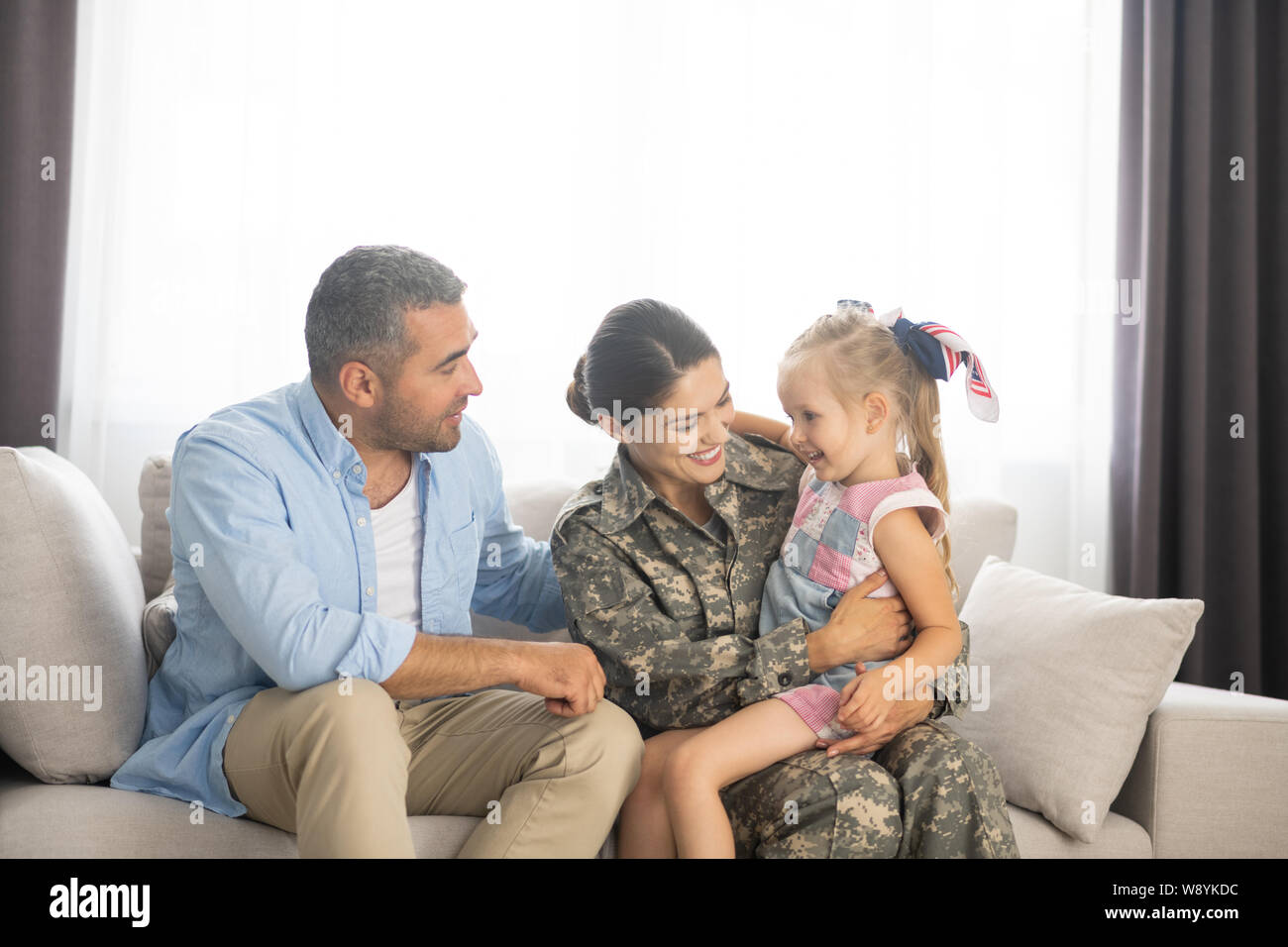 Family feeling happy while reuniting at home Stock Photo - Alamy