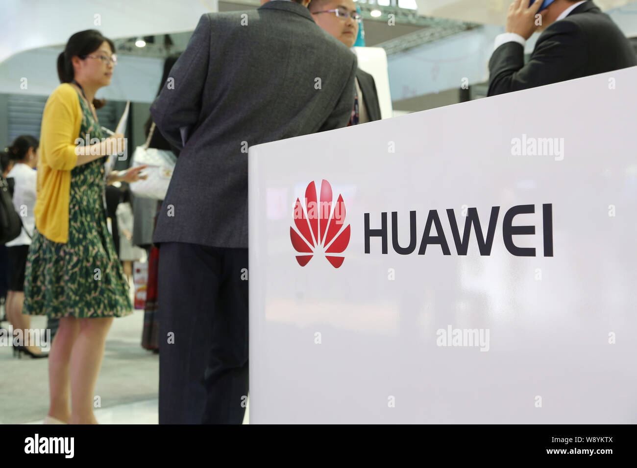 --FILE--People visit the stand of Huawei during the 3rd Mobile Asia ...