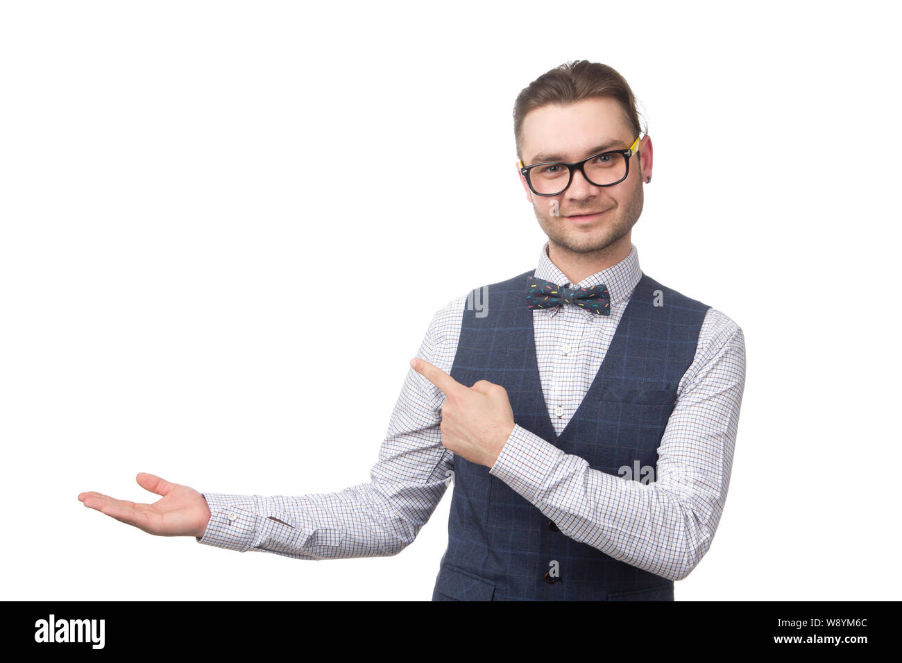 Happy young businessman presenting and promoting isolated on white ...
