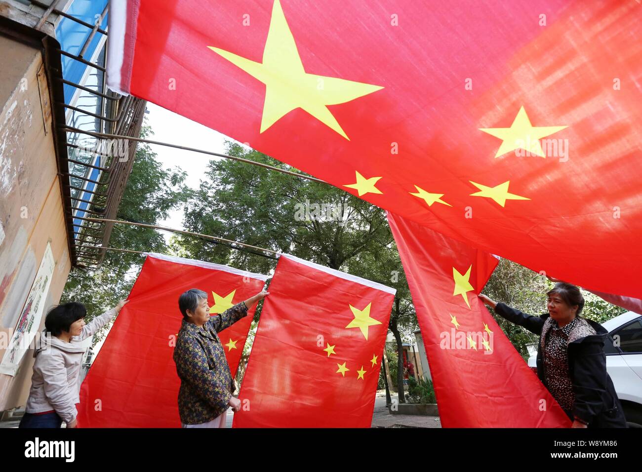 Local residents decorate the residential area with Chinese national ...