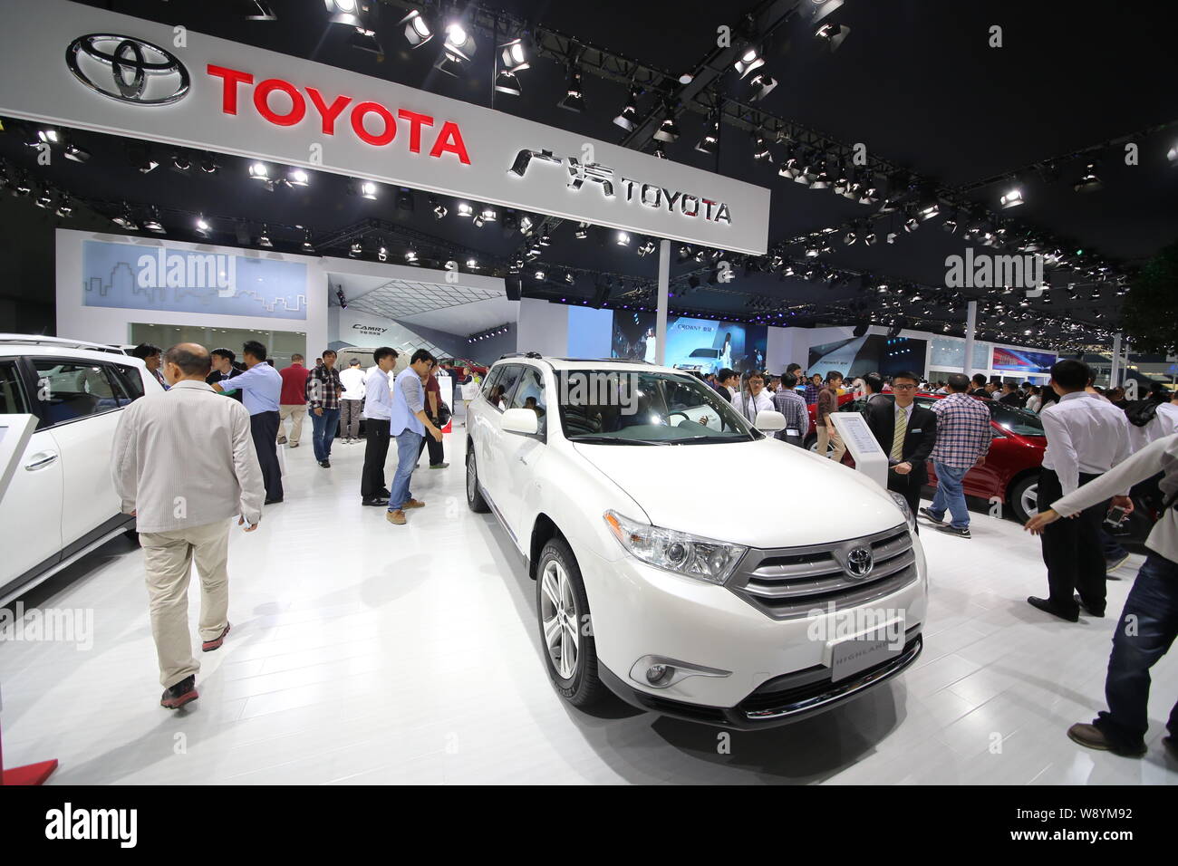 --FILE--Visitors try out or look at a Highlander SUV and other cars of ...