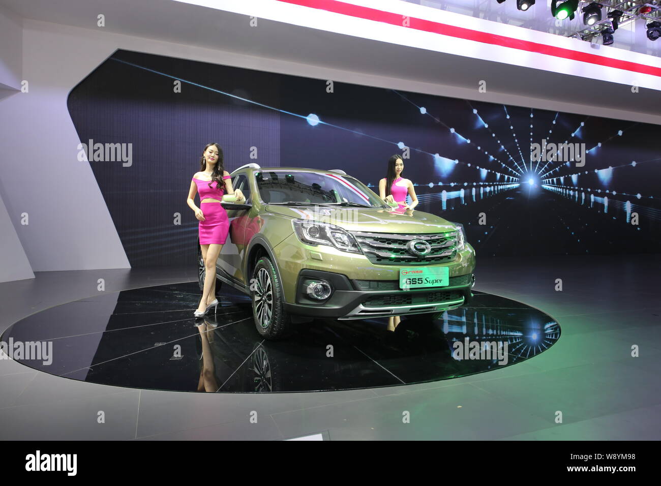 --FILE--Models pose with a GS5 Super of GAC Motor during the 12th China ...