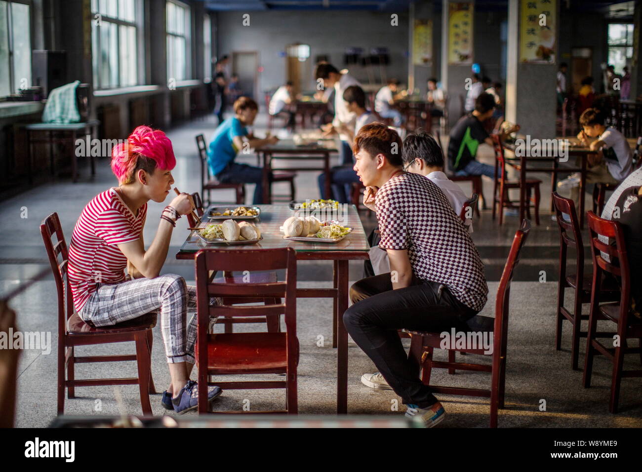 Chinese students eat supper made by the students from the cooking class ...